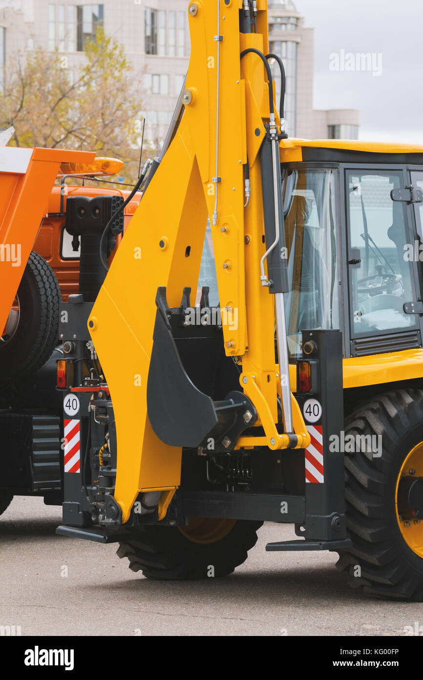 Yellow road constructor tractor - industrial equipment Stock Photo - Alamy