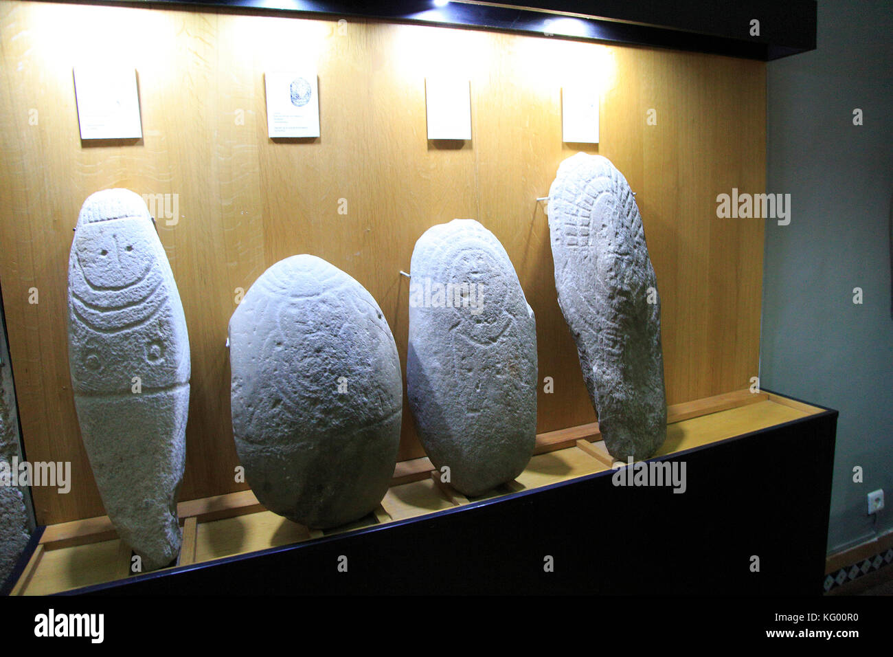 Bronze Age stone tablets with carved faces and human forms in museum ...