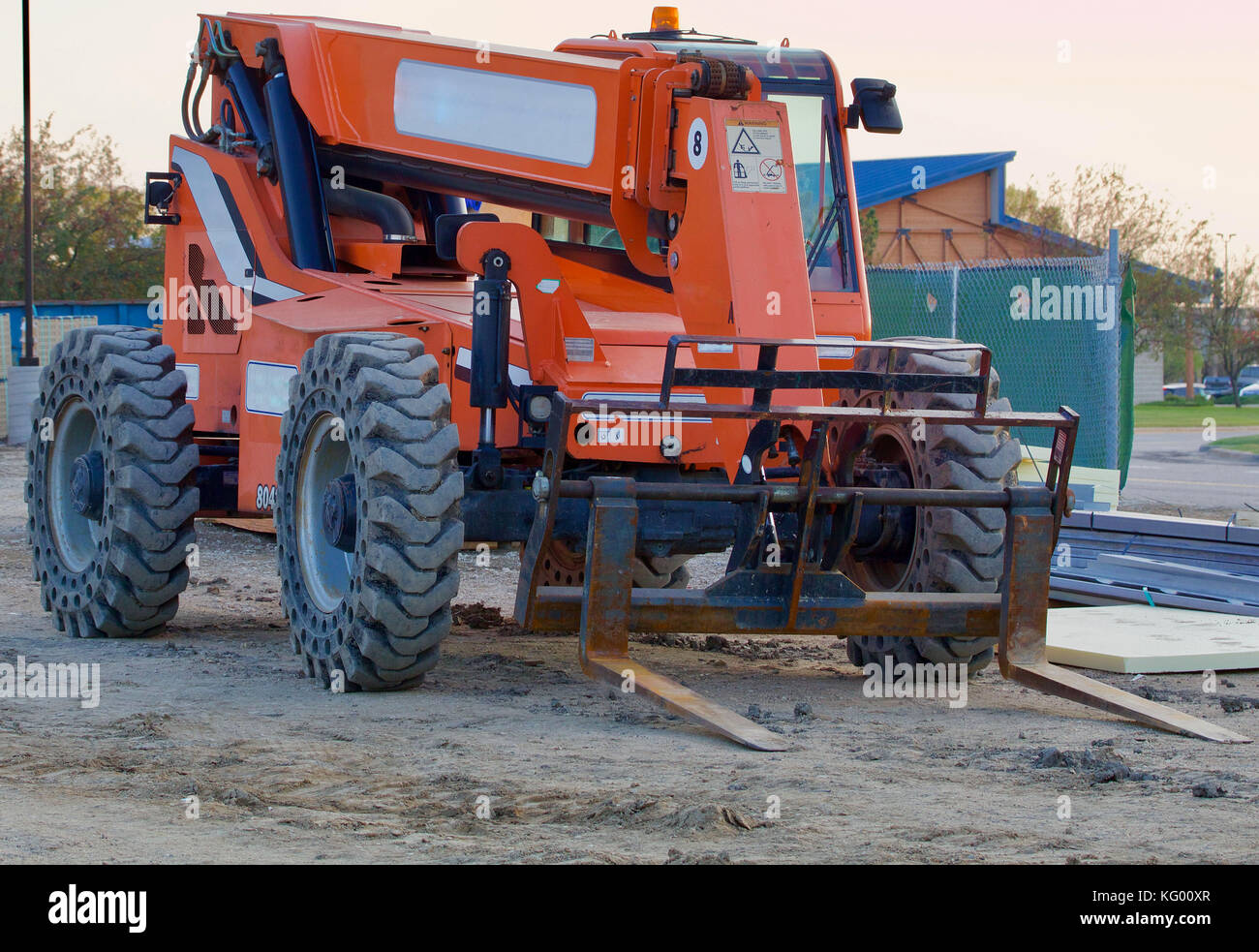 Orange fork lift Stock Photo - Alamy