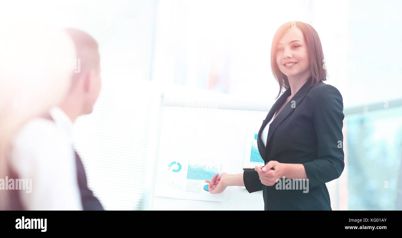 Businesswoman asking question during her colleagues presentation Stock ...
