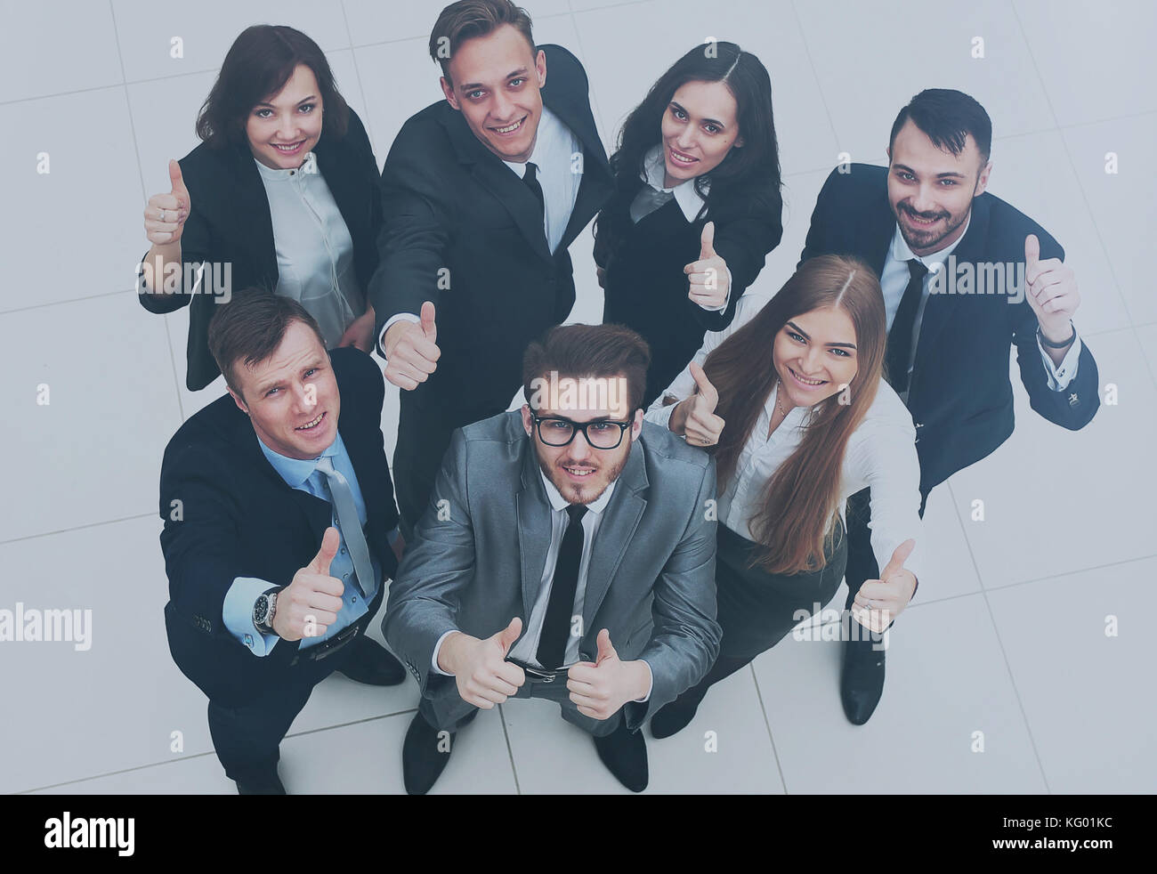 Top view of executives smiling and pointing Stock Photo - Alamy