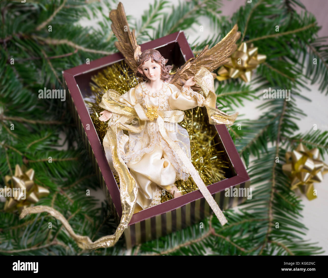 A toy angel in a gift box Stock Photo - Alamy