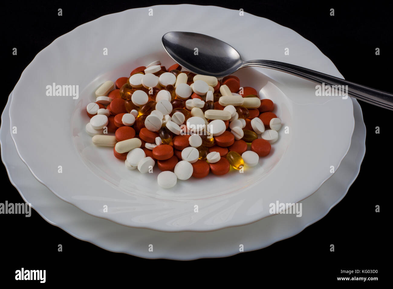 Spoon with colored tablets hi-res stock photography and images - Alamy