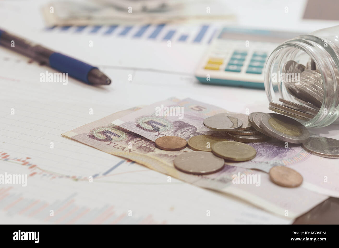 financial chart and coins on paper Stock Photo - Alamy