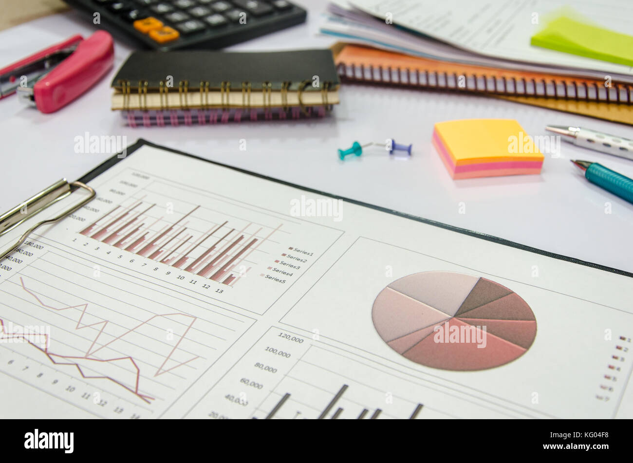 business report and chart on table Stock Photo - Alamy