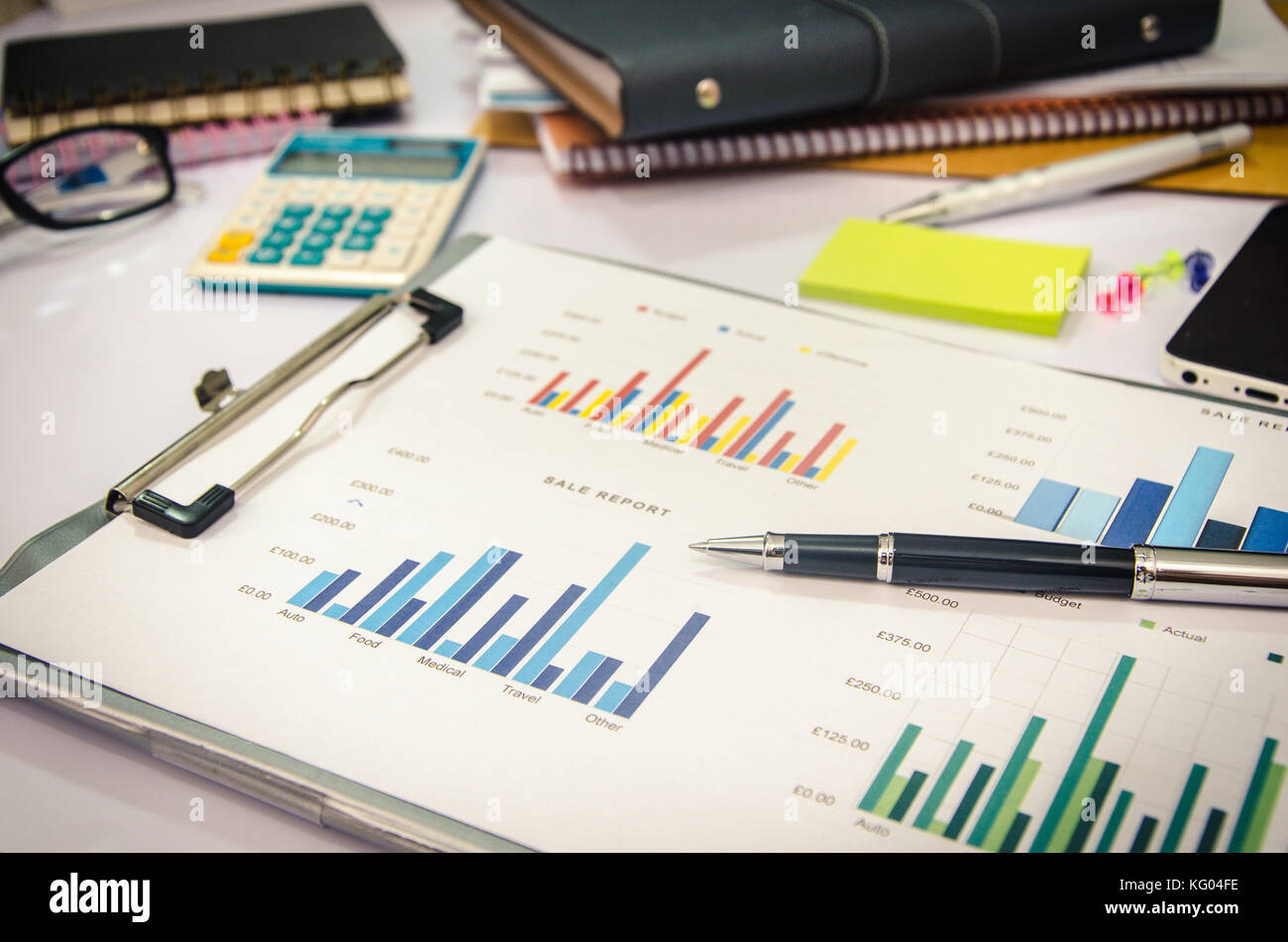 business report and chart on table Stock Photo - Alamy