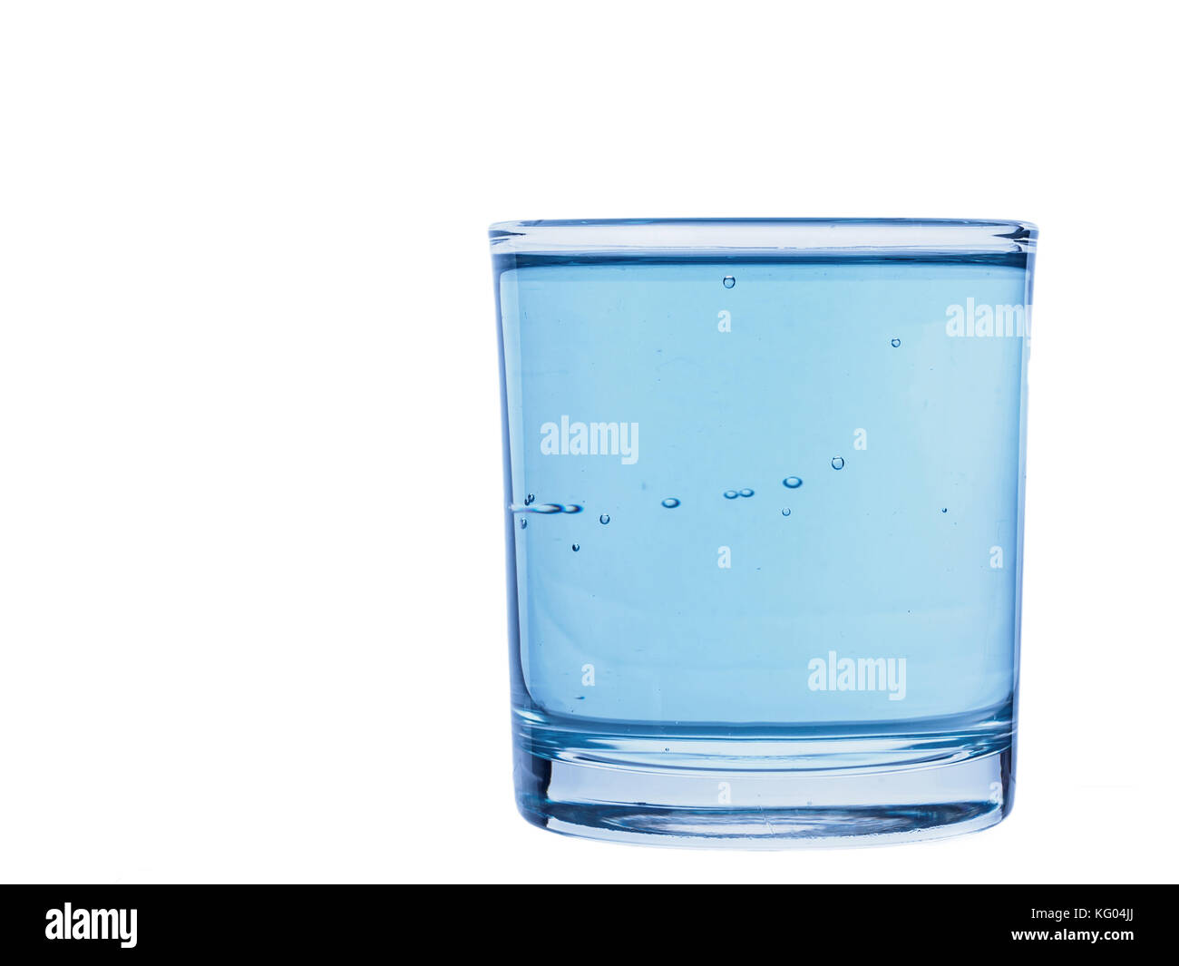 blue water in glass isolated on white backgroubd Stock Photo - Alamy