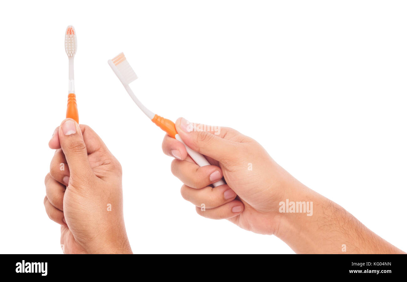 male hand holding toothbrush isolated on white background Stock Photo ...