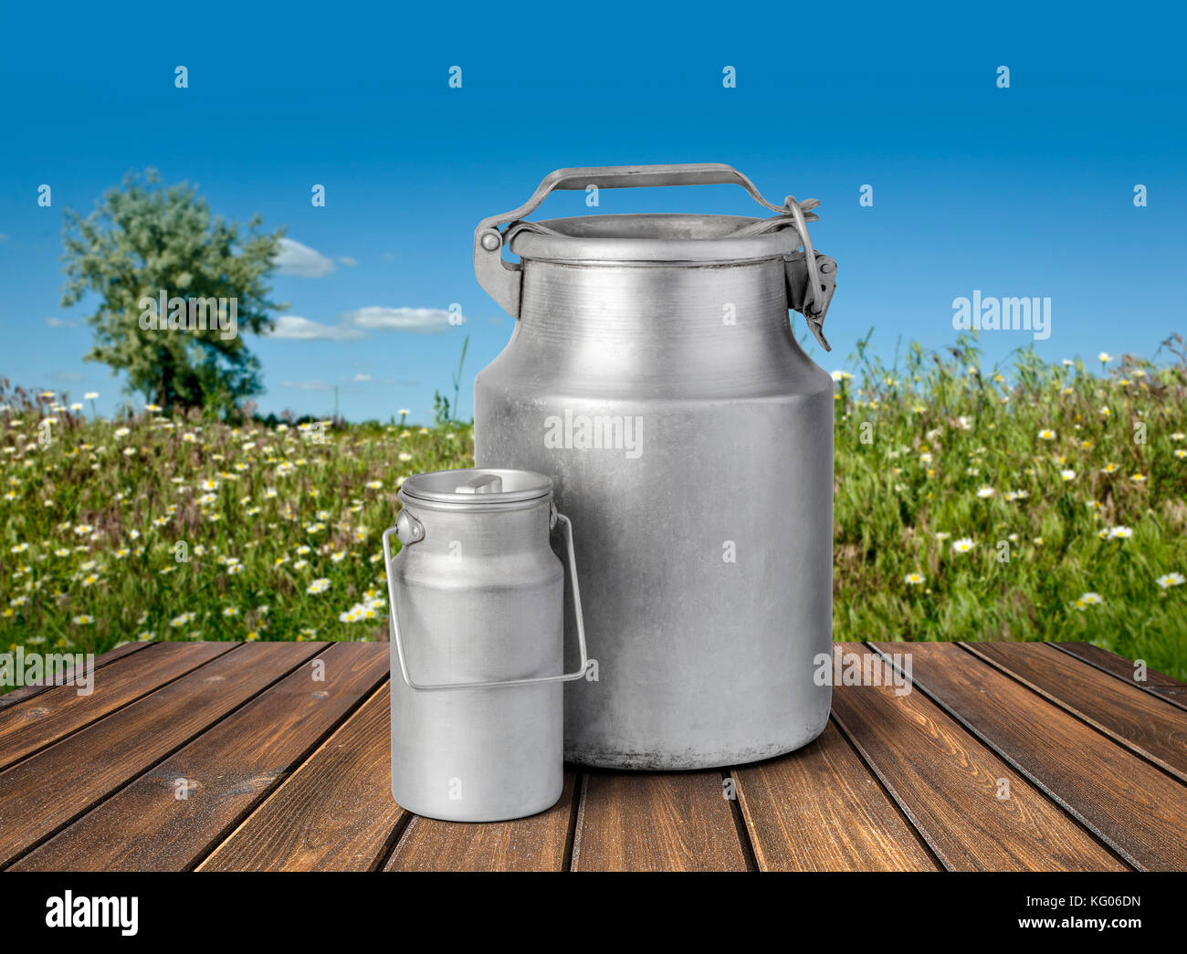 Retro can for milk on wooden table, withy clipping path Stock Photo - Alamy