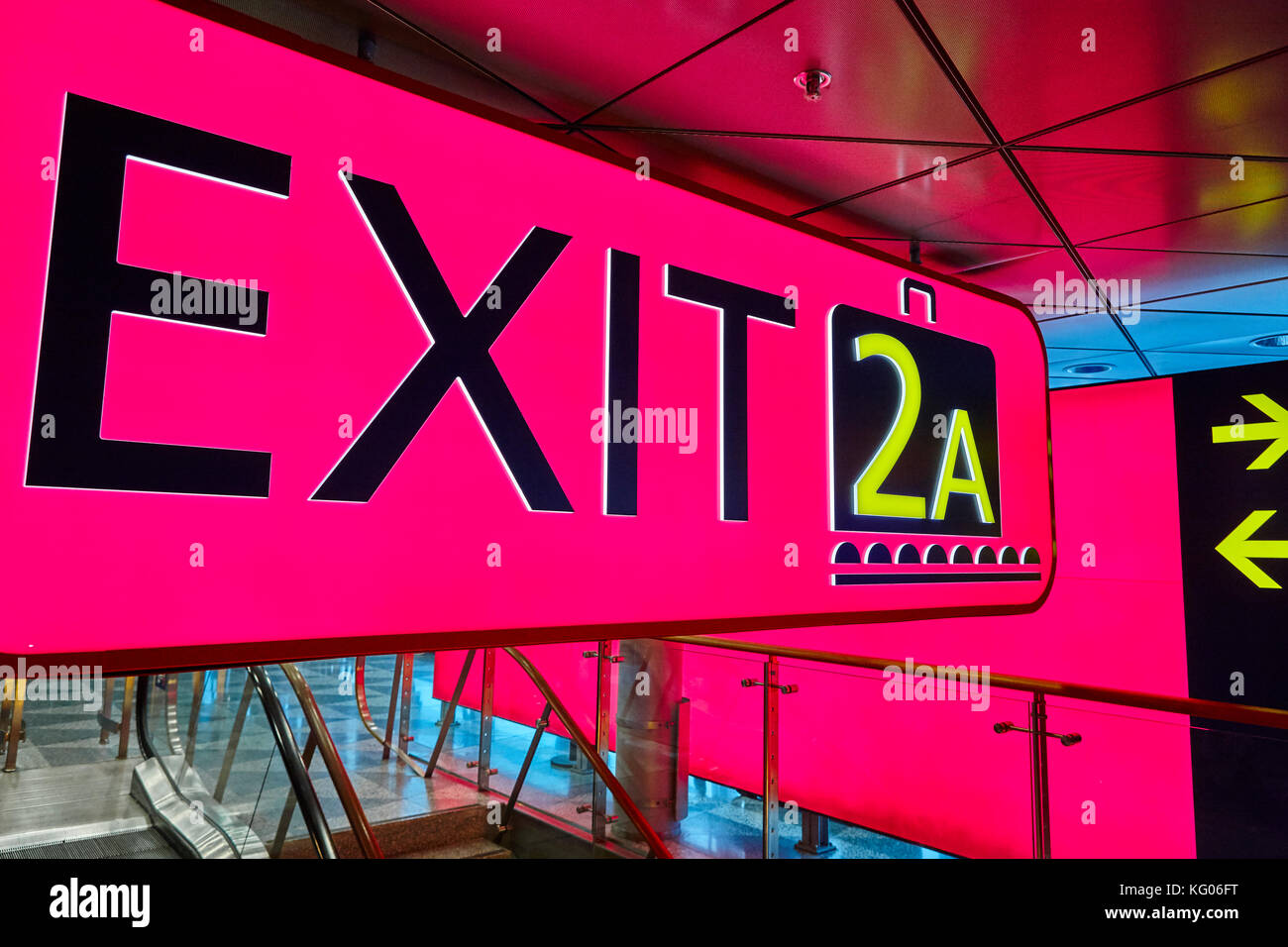 Exit information signal post at airport terminal. Travel background ...