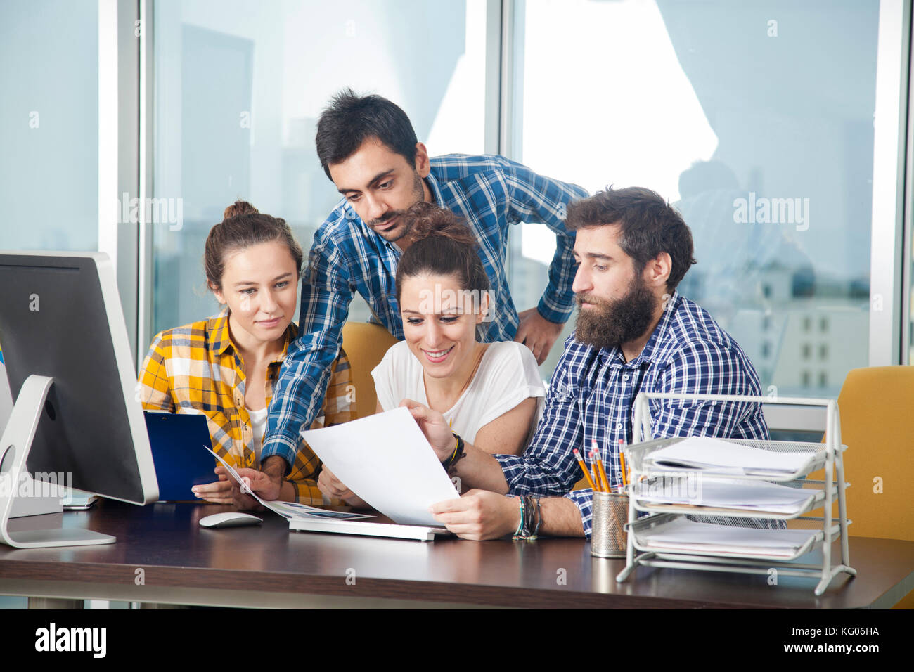 Group of happy creative people working in the office Stock Photo - Alamy