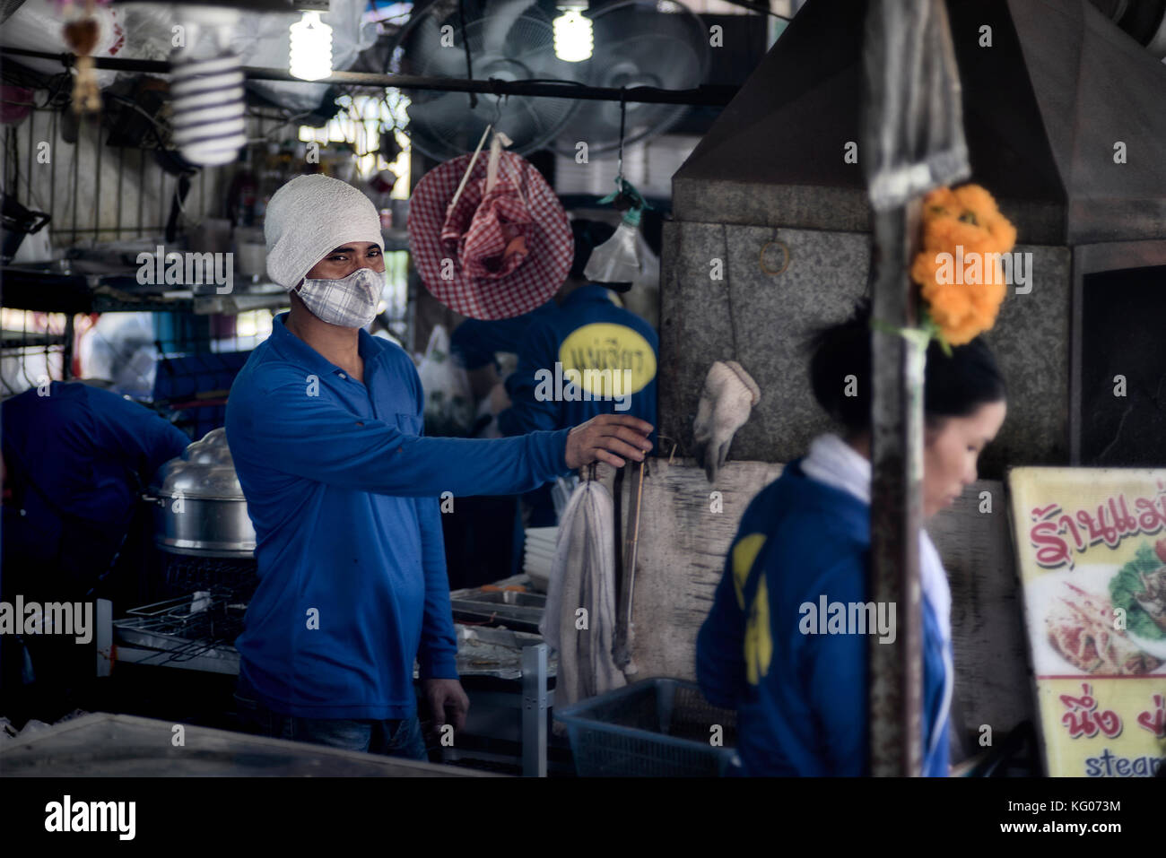 Anti pollution face mask. Thailand BBQ cook wearing smog and facemask ...