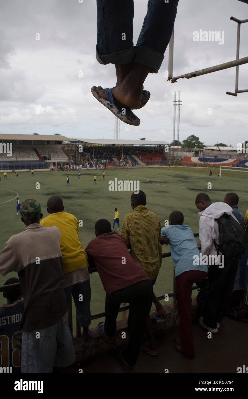 Soccer fans watch a match at the national stadium in Monrovia, Liberia ...