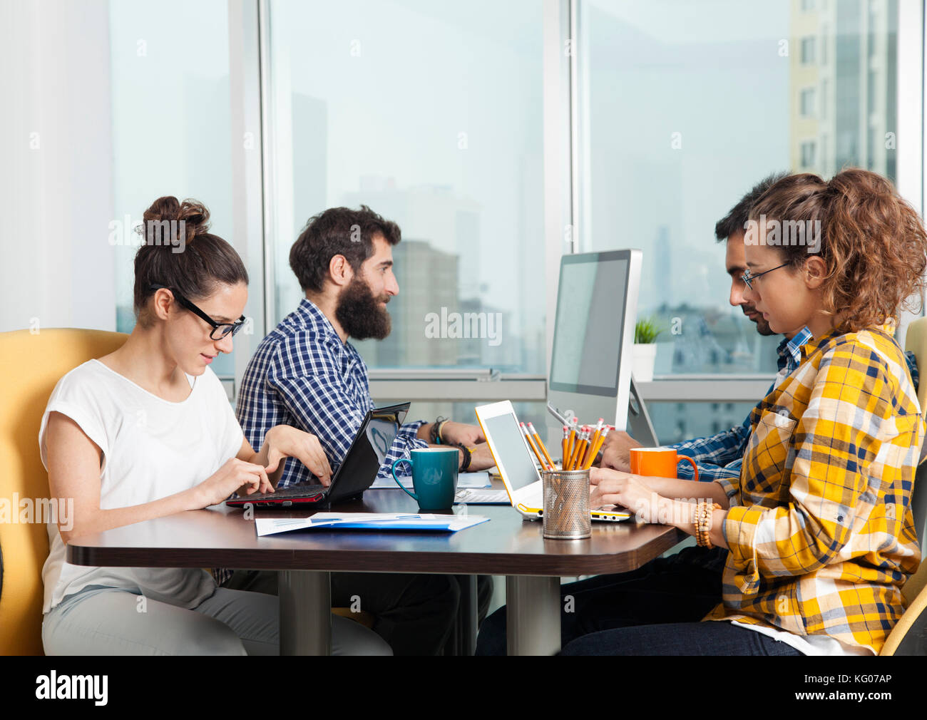Group of happy creative people working in the office Stock Photo - Alamy