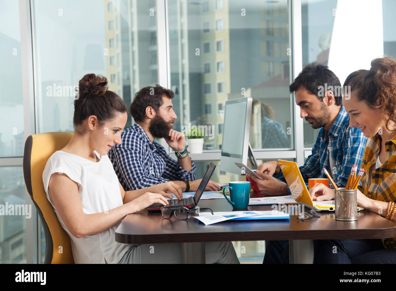 Group of happy creative people working in the office Stock Photo - Alamy