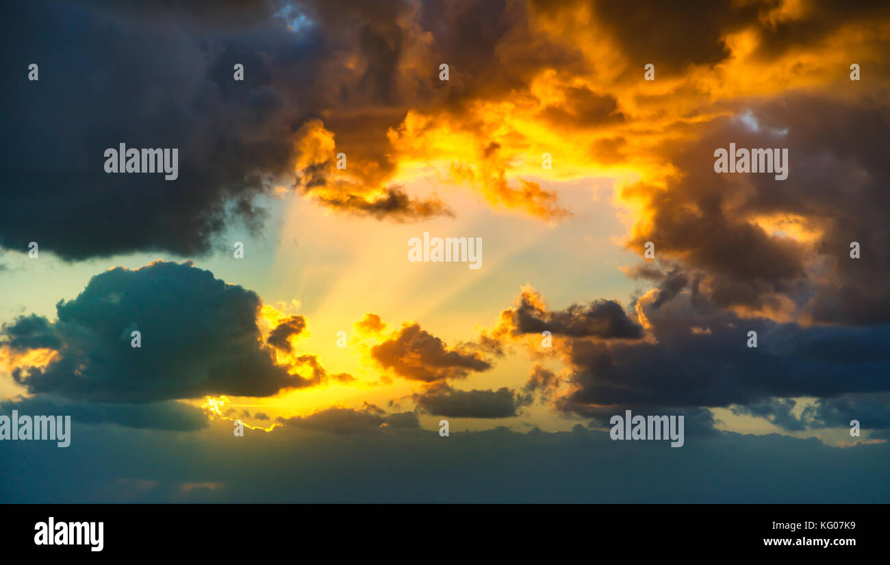 Dramatic sunset sky with yellow, blue and orange approaching ...