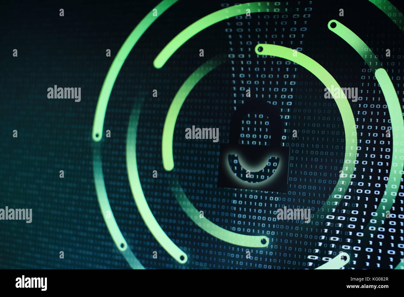 photo of computer screen display with black graphic lock symbol. Binary ...
