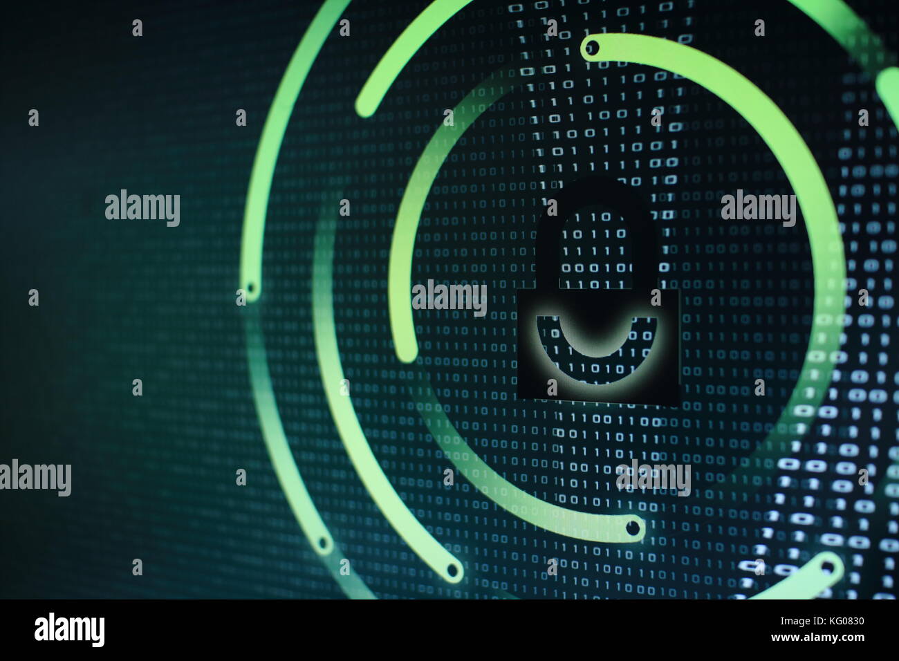 photo of computer screen display with black graphic lock symbol. Binary ...