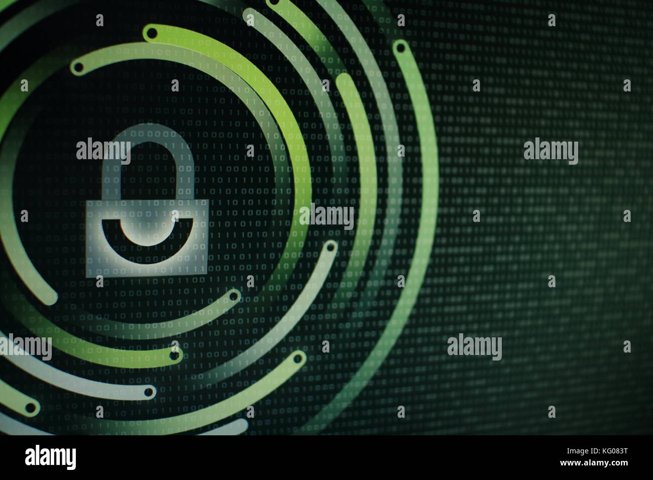 photo of computer screen display with black graphic lock symbol. Binary ...