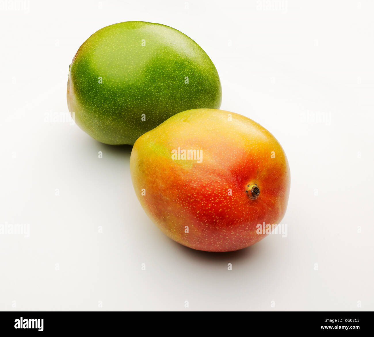 two rioe mango fruits isolated on white Stock Photo - Alamy