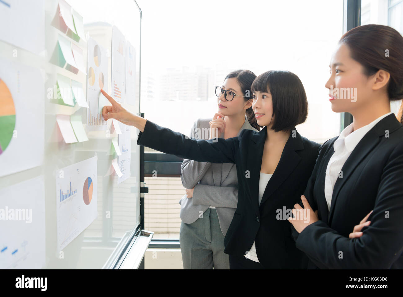 pretty elegant female office worker pointing chart document asking ...