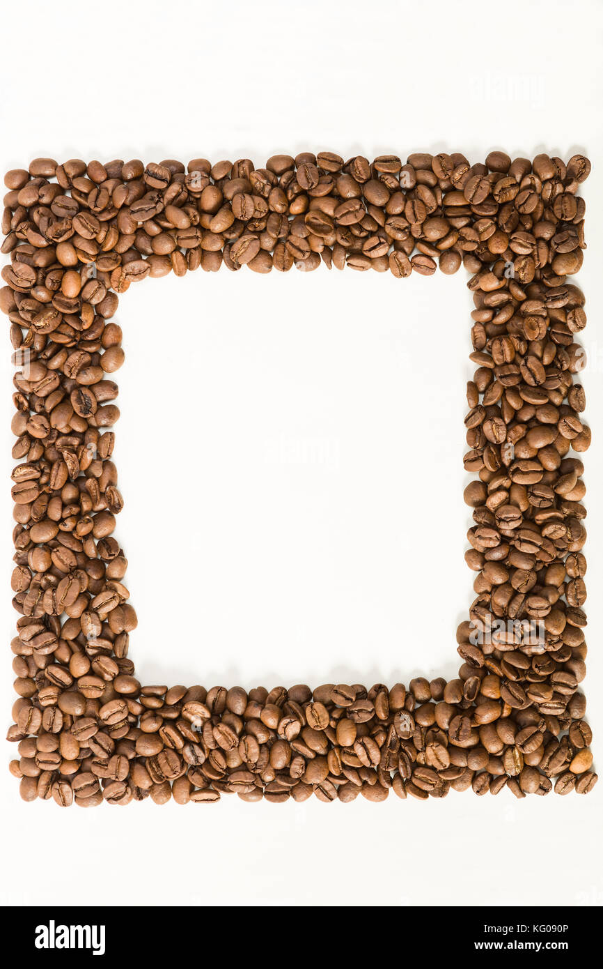 Roasted coffee beans frame over white background with space for text or ...