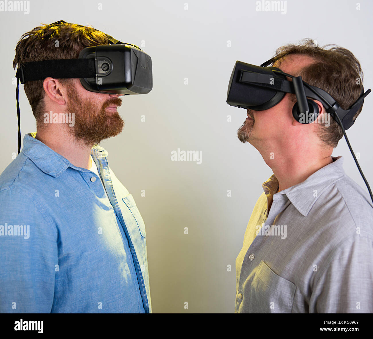 Two men using the Oculus Rift VR headsets, version 2 and 3 Stock Photo ...