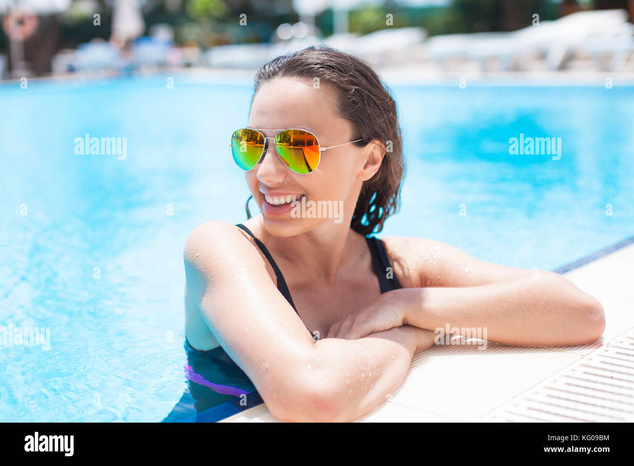 Young woman in swimming pool hi-res stock photography and images - Alamy