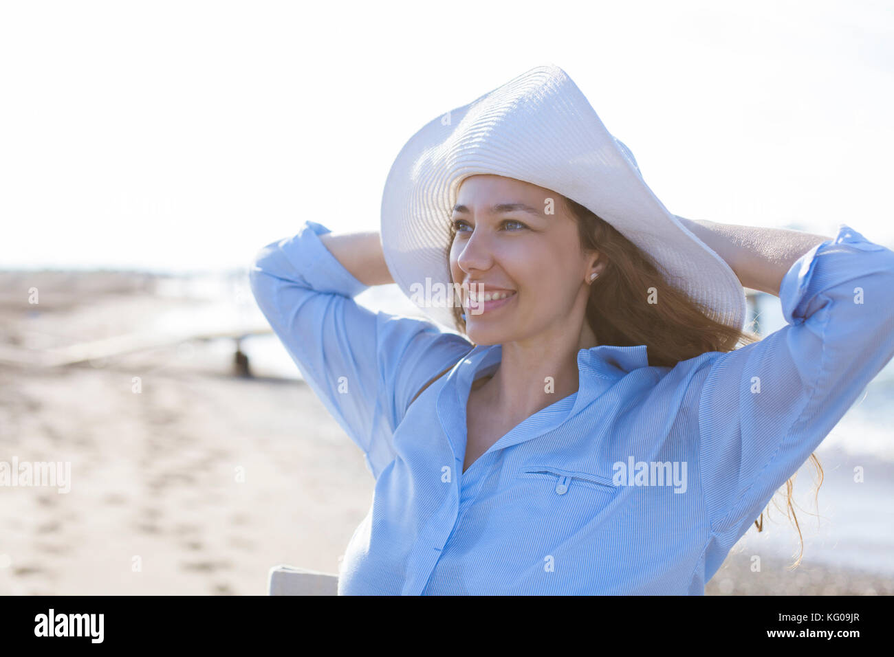 Young smiling woman at the beach near sea Stock Photo - Alamy