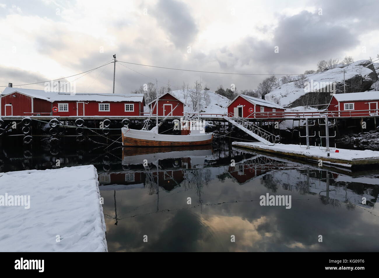 Nusfjord fishing village-snow covered harbor with floating pontoons and ...