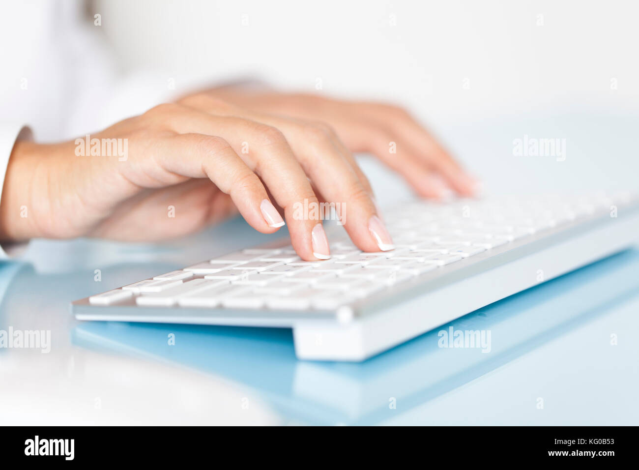 Close-up of business woman's hands touching computer keys during work ...