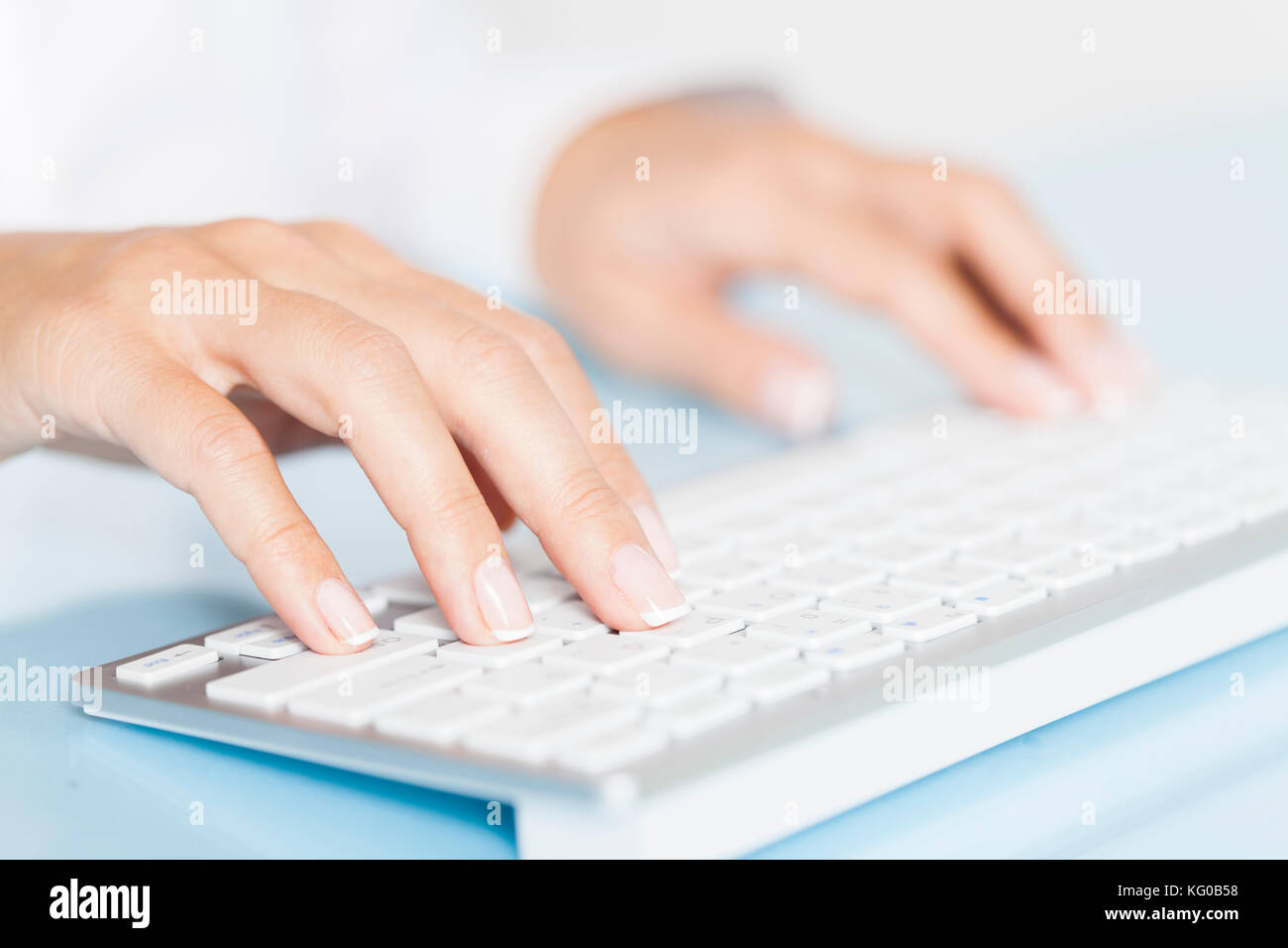Close-up of business woman's hands touching computer keys during work ...