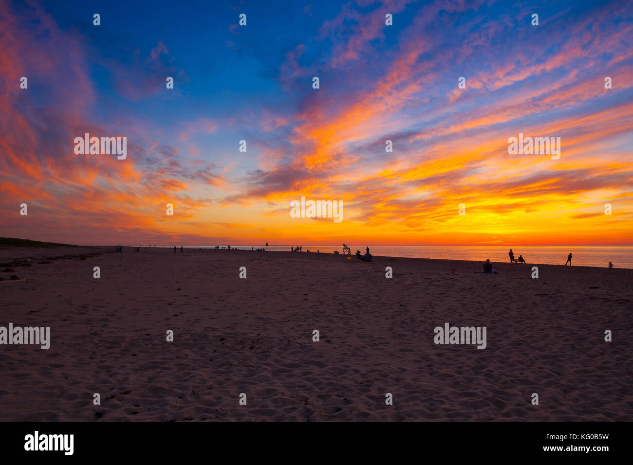 People watching the amazing sunset on the Cape Cod beach, USA Stock ...