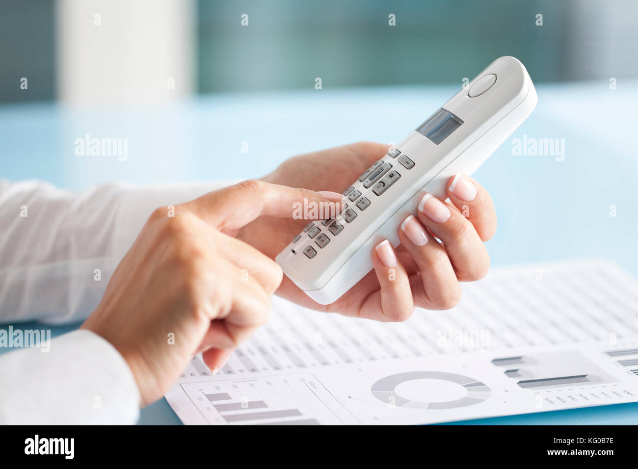 Close up of a woman using landline phone Stock Photo - Alamy