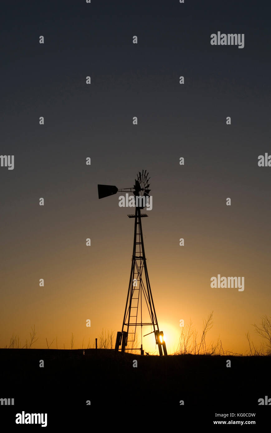 SILHOUETTE OF WINDMILL ON A RANCH AT SUNRISE Stock Photo - Alamy