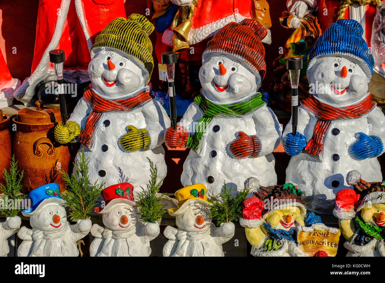 Colorfully painted little statues of snowman, made from clay Stock ...