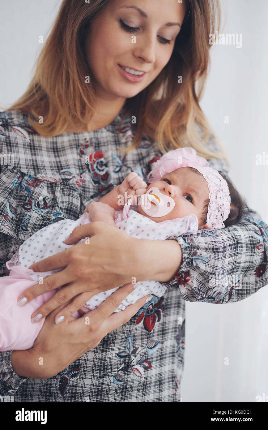beautiful young mother with cute newborn baby Stock Photo - Alamy