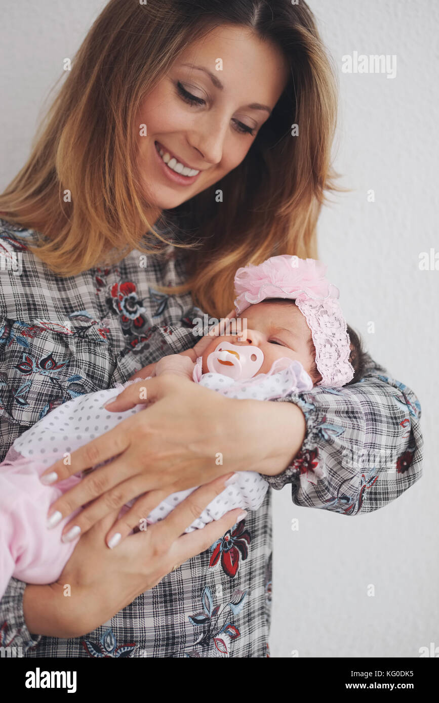 beautiful young mother with cute newborn baby Stock Photo - Alamy