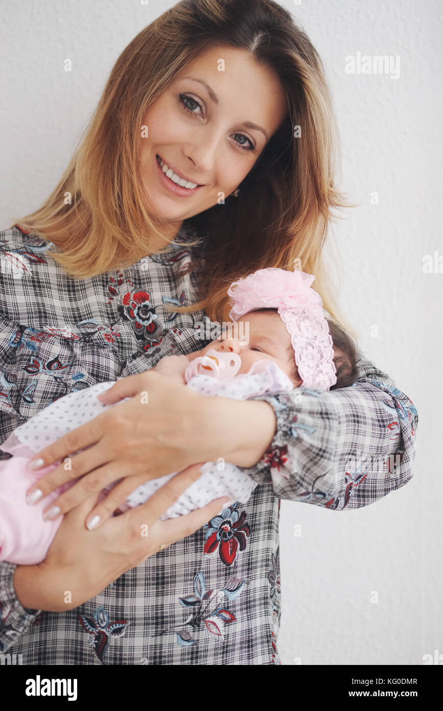 beautiful young mother with cute newborn baby Stock Photo - Alamy