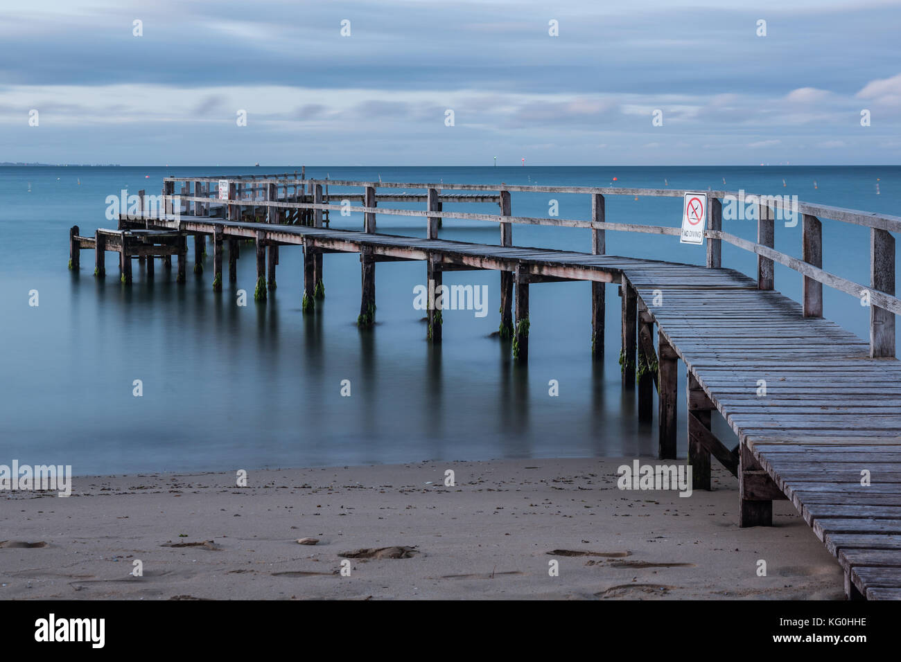 Small bent jetty with long exposure at Portsea Victoria Stock Photo - Alamy
