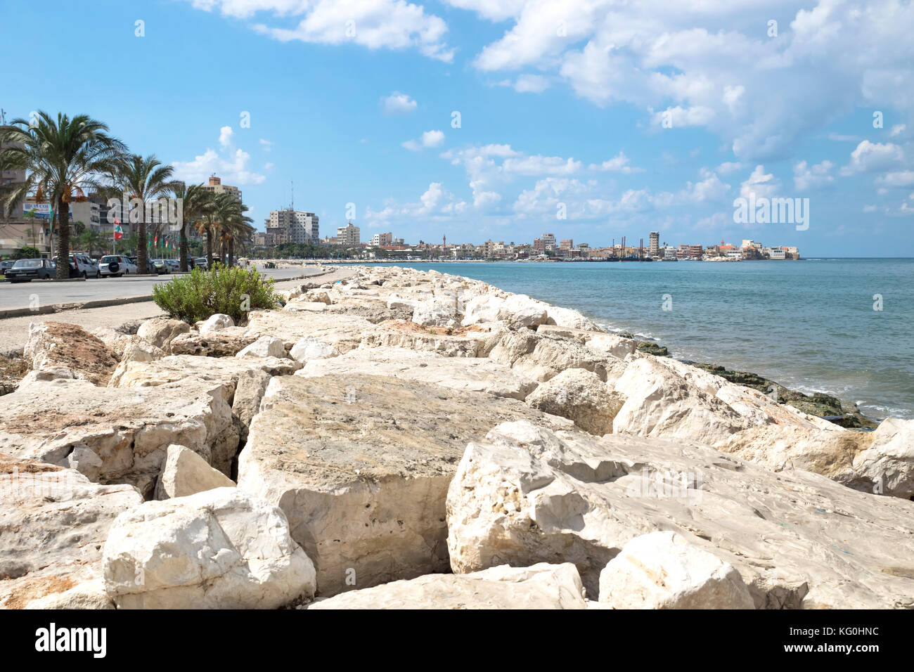 Boardwark along the coast of Tyre with the old city and harbour in the ...