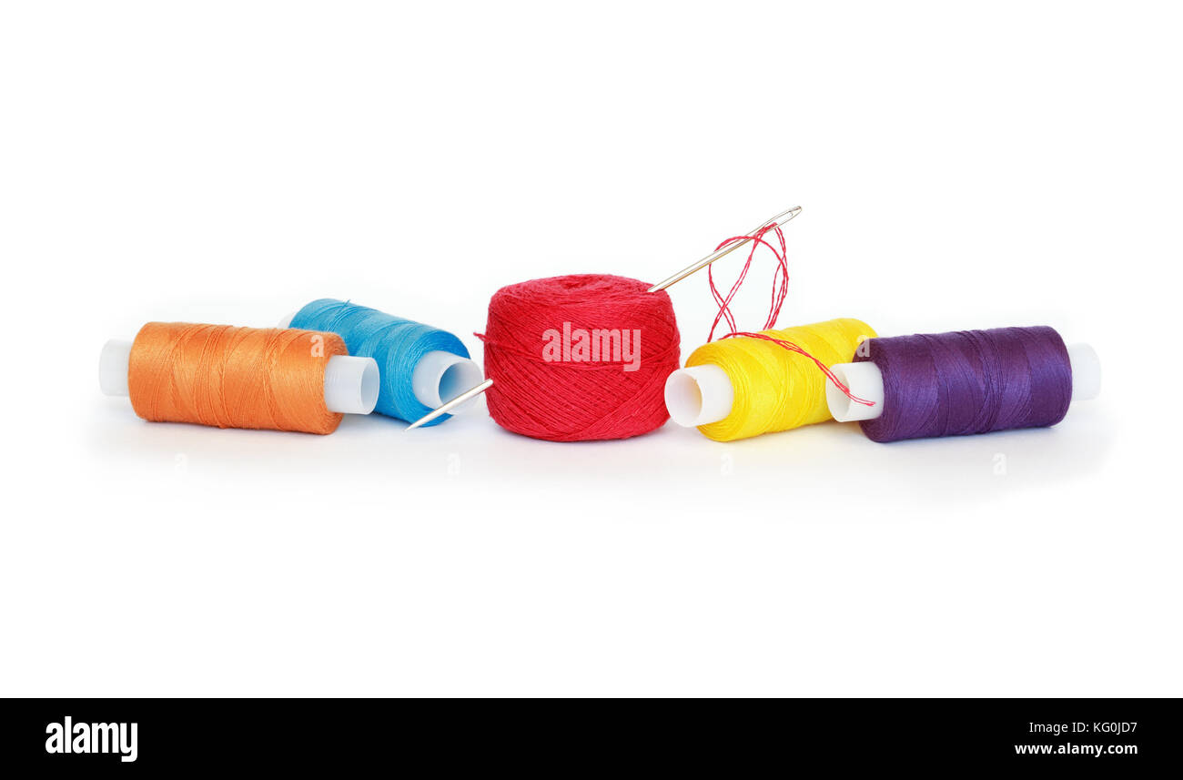 Colorful threads and needle on white background Stock Photo - Alamy