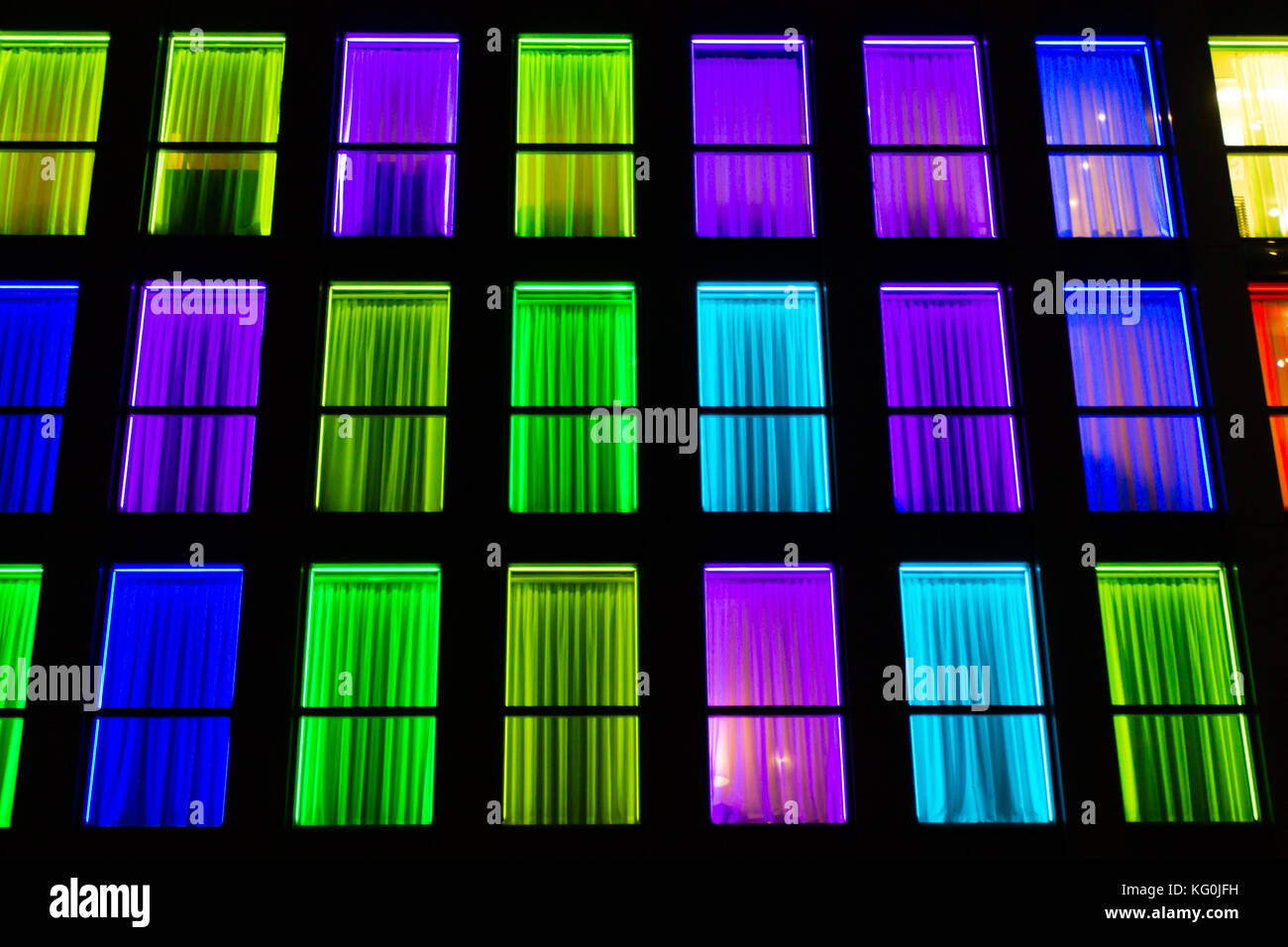 Colored windows texture. Windows illuminated by neon lights background ...