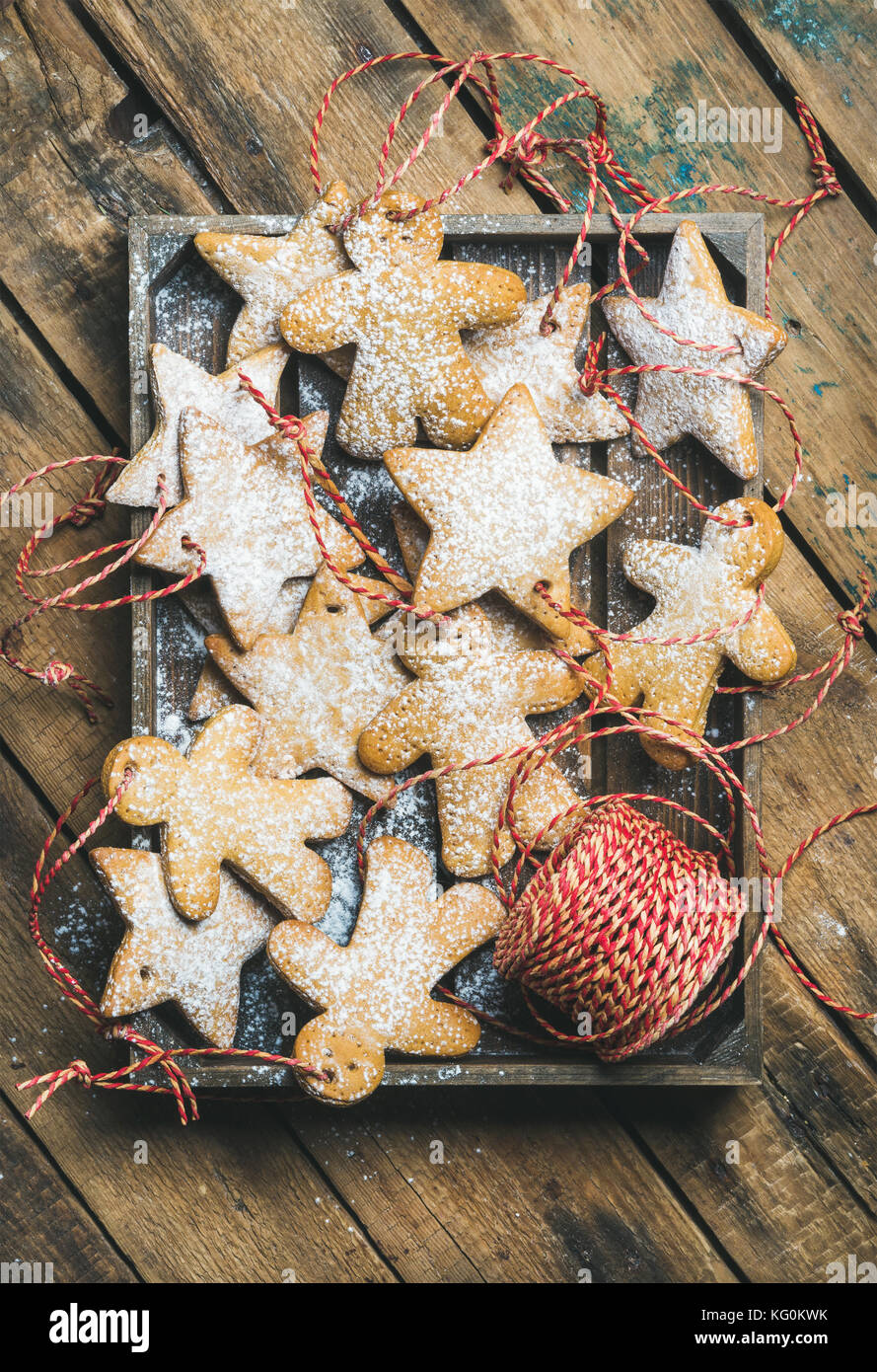 Christmas gingerbread star and angel shaped cookies with sugar powder ...