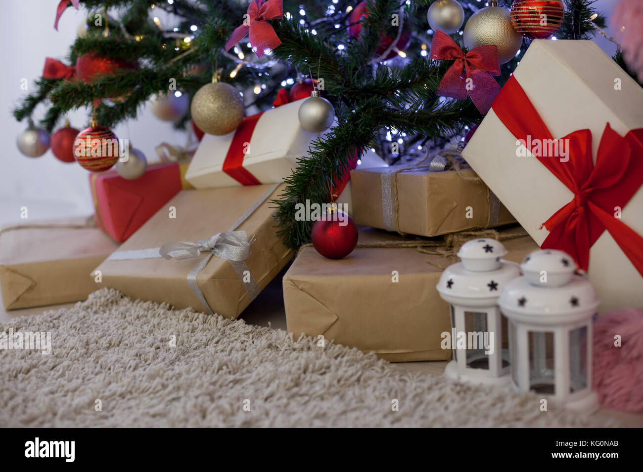 Christmas gifts under the Christmas tree Stock Photo - Alamy