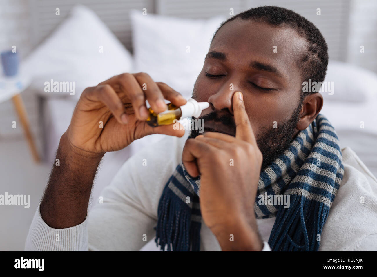 Calm concentrated man curing his flu at home Stock Photo - Alamy