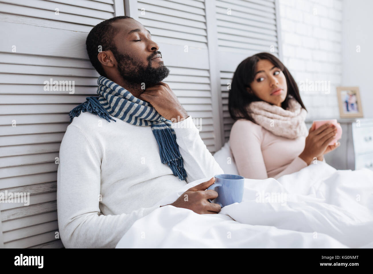 Lovely couple recovering from flu together Stock Photo - Alamy