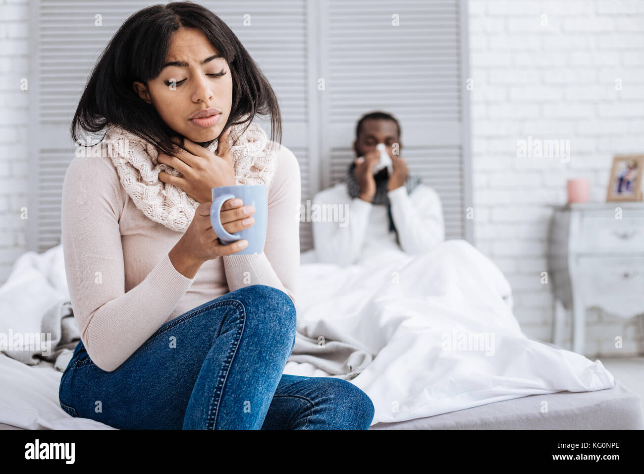 Bored tired woman looking tired of drinking tea Stock Photo - Alamy