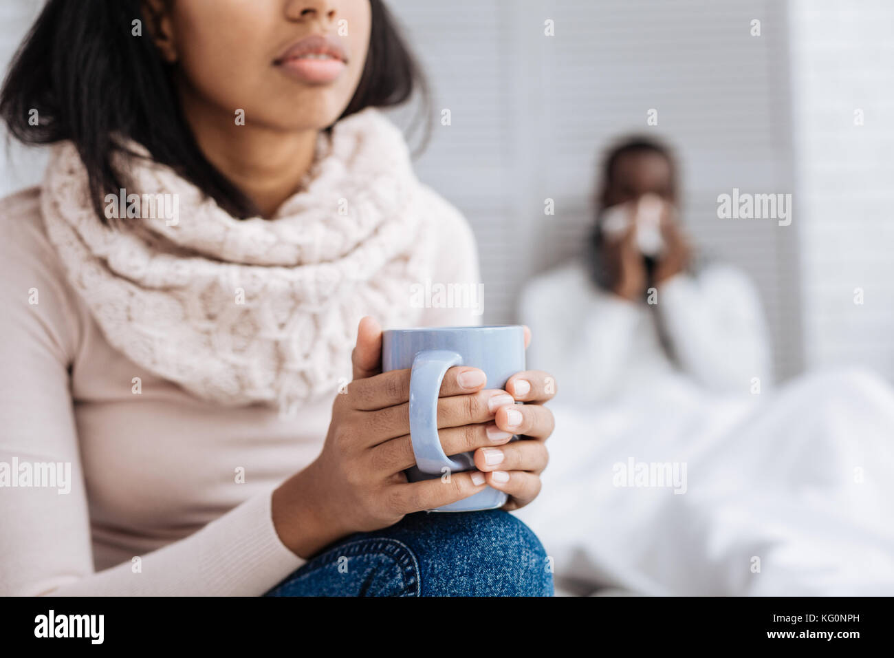 Calm relaxed woman sitting with a cup of hot drink Stock Photo - Alamy