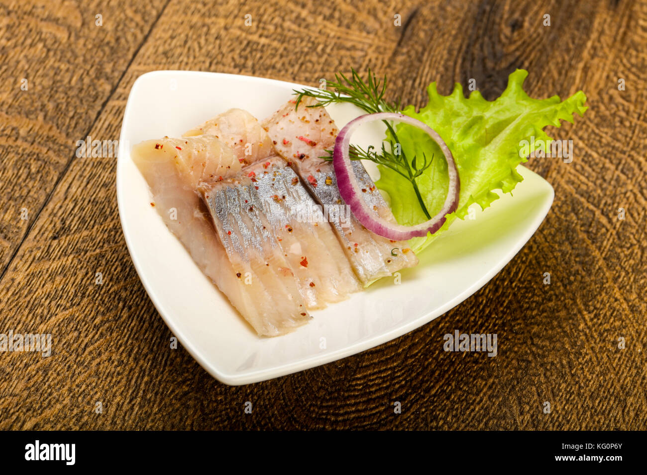 Sliced Herring fillet with dill and onion Stock Photo - Alamy